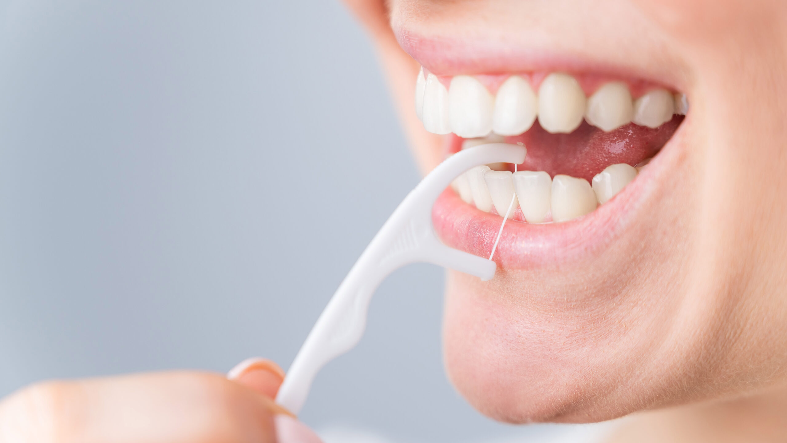 Safely Remove Objects Stuck Between Teeth at Home - Sopris Smiles
